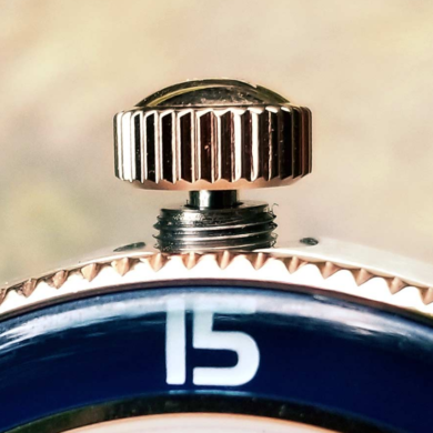 What is an exhibition style caseback in a watch?